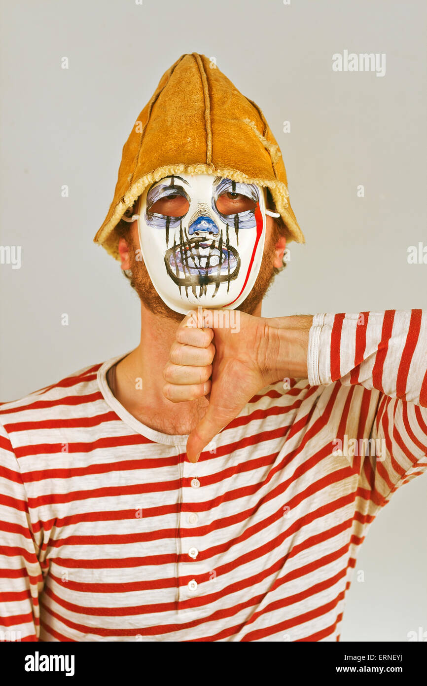 Weird scary masked mime in striped red and white shirt Stock Photo - Alamy