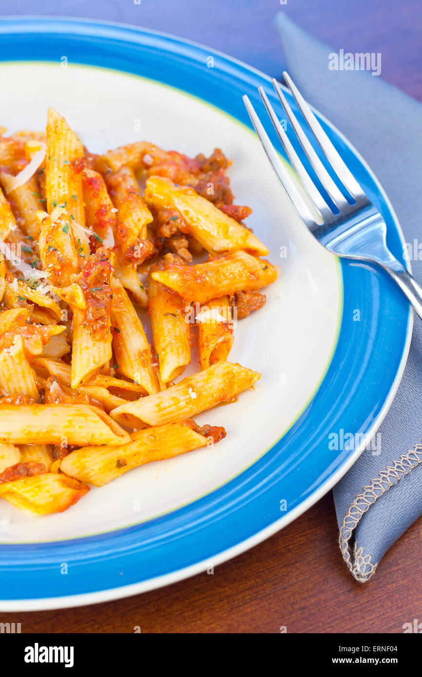 Penne pasta with ground beef meat sauce Stock Photo - Alamy