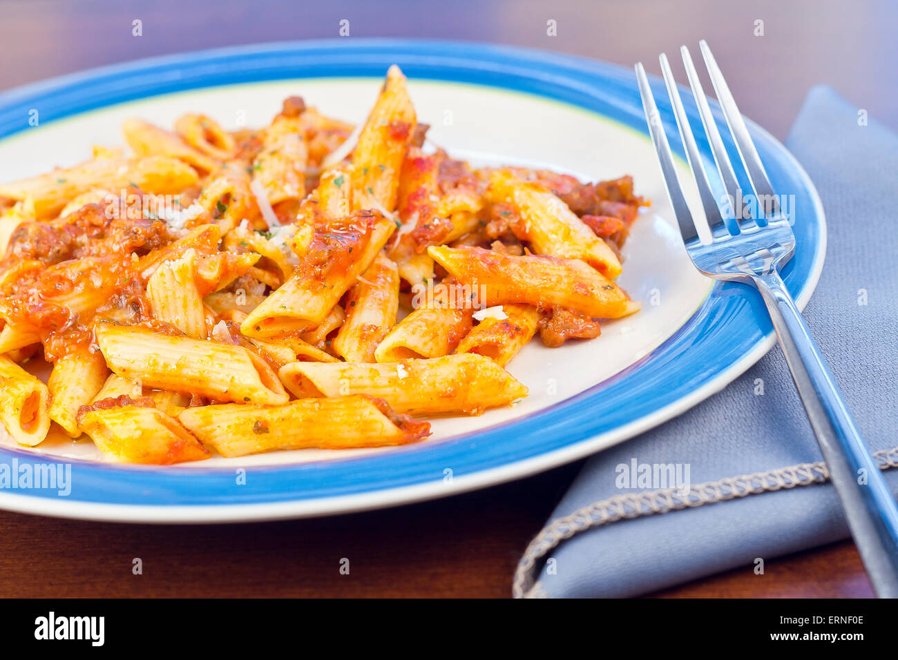 Penne pasta with ground beef meat sauce Stock Photo - Alamy