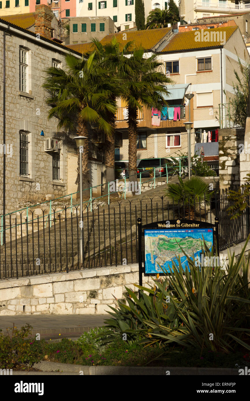 Gibraltar welcome sign with apartments and palm trees in the background ...
