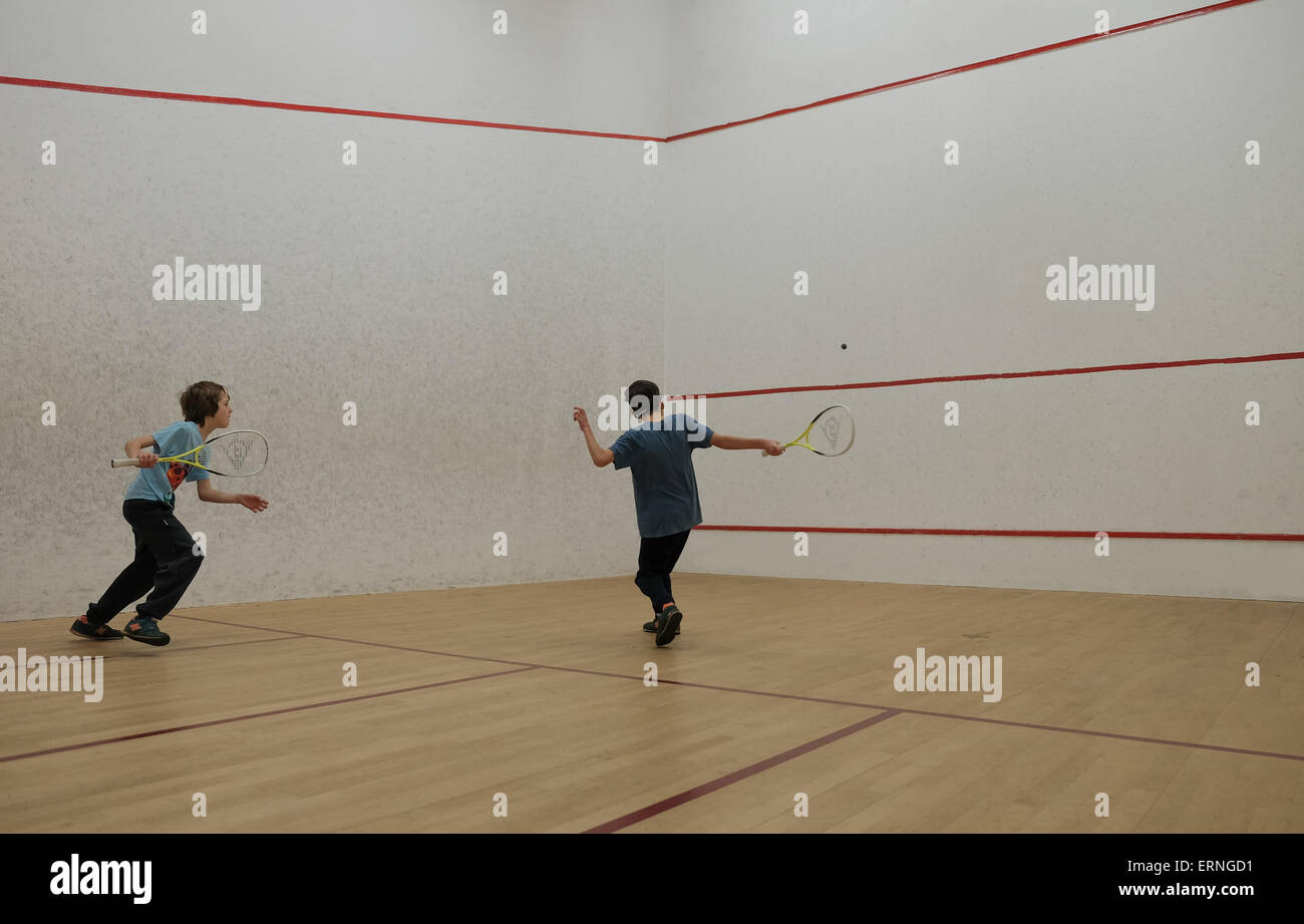 Young boys play squash Stock Photo - Alamy