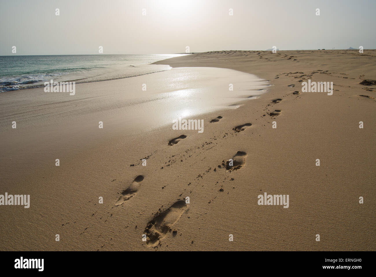 Foot steps in the sand Stock Photo - Alamy