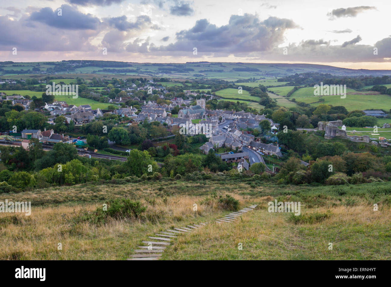 steep stone steps leading to English village and countryside at sunset ...