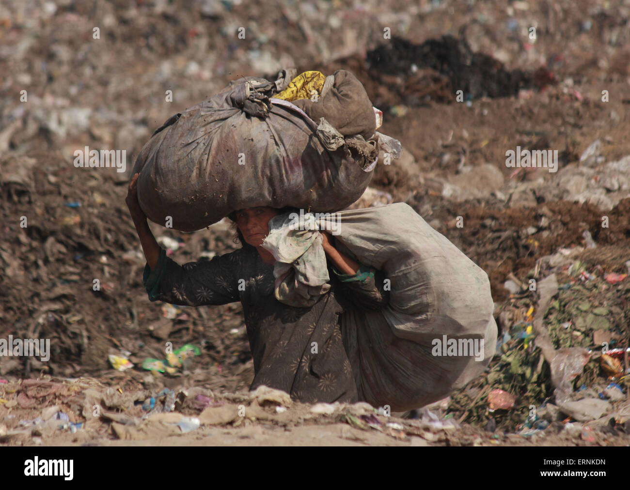 Lahore, Pakistan. 05th June, 2015. Gypsy rag-pickers search for ...