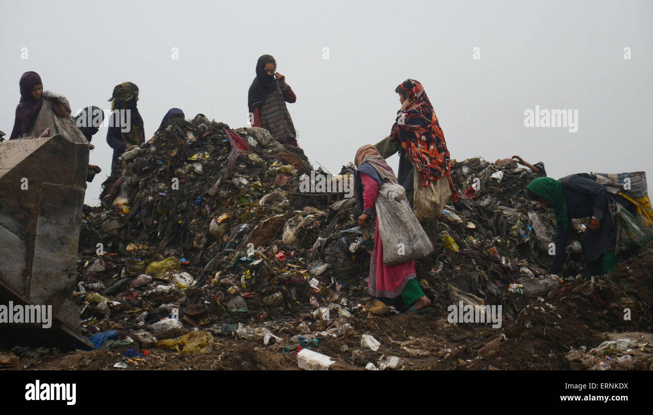 Lahore, Pakistan. 05th June, 2015. Gypsy rag-pickers search for ...