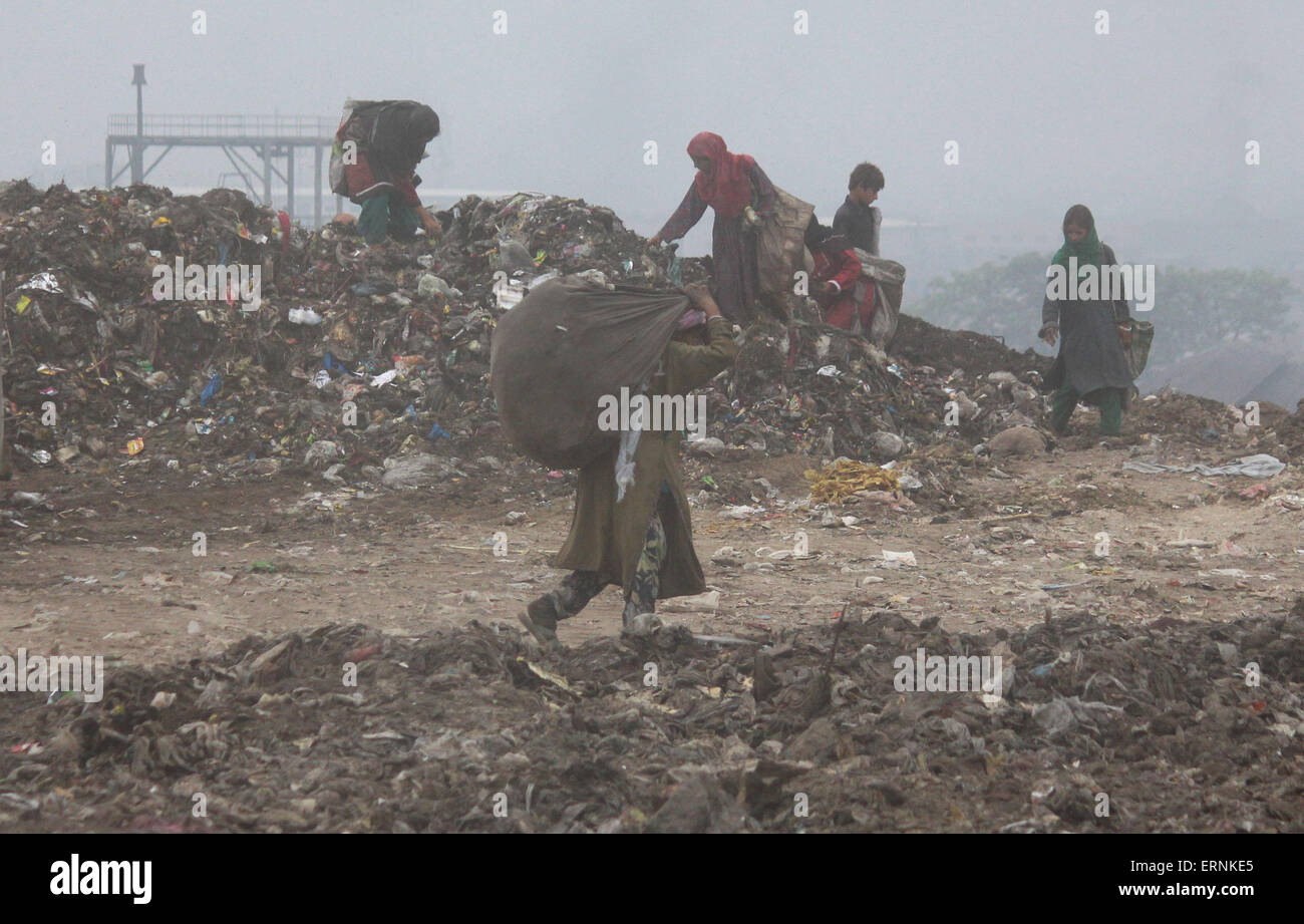 Lahore, Pakistan. 05th June, 2015. Gypsy rag-pickers search for ...