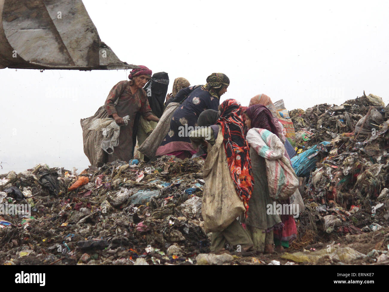 Lahore, Pakistan. 05th June, 2015. Gypsy rag-pickers search for ...