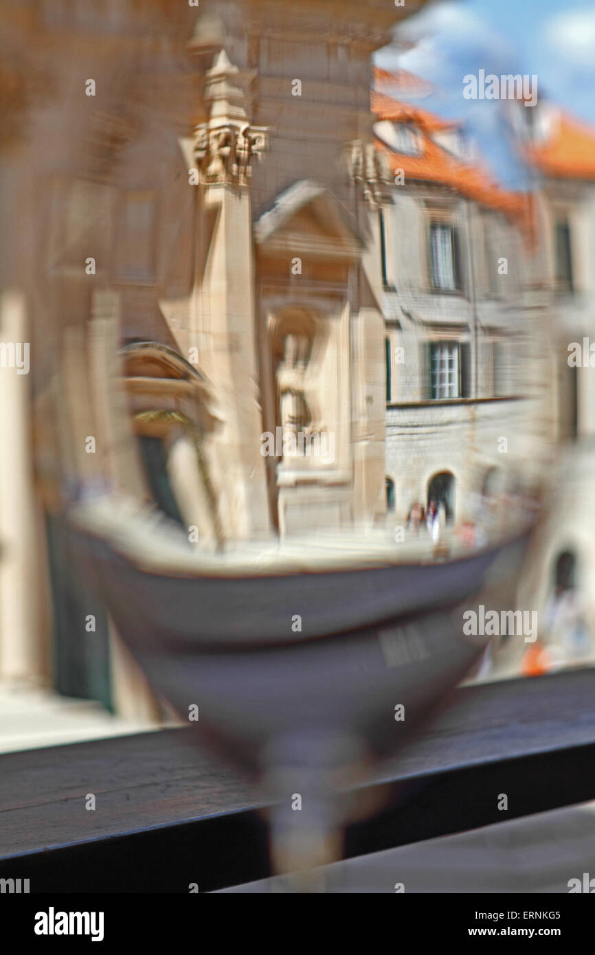 Abstract view through a wine glass of classical buildings in Dubrovnik ...