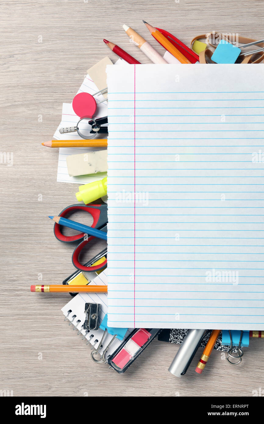 Blank paper on lots of office supplies Stock Photo - Alamy