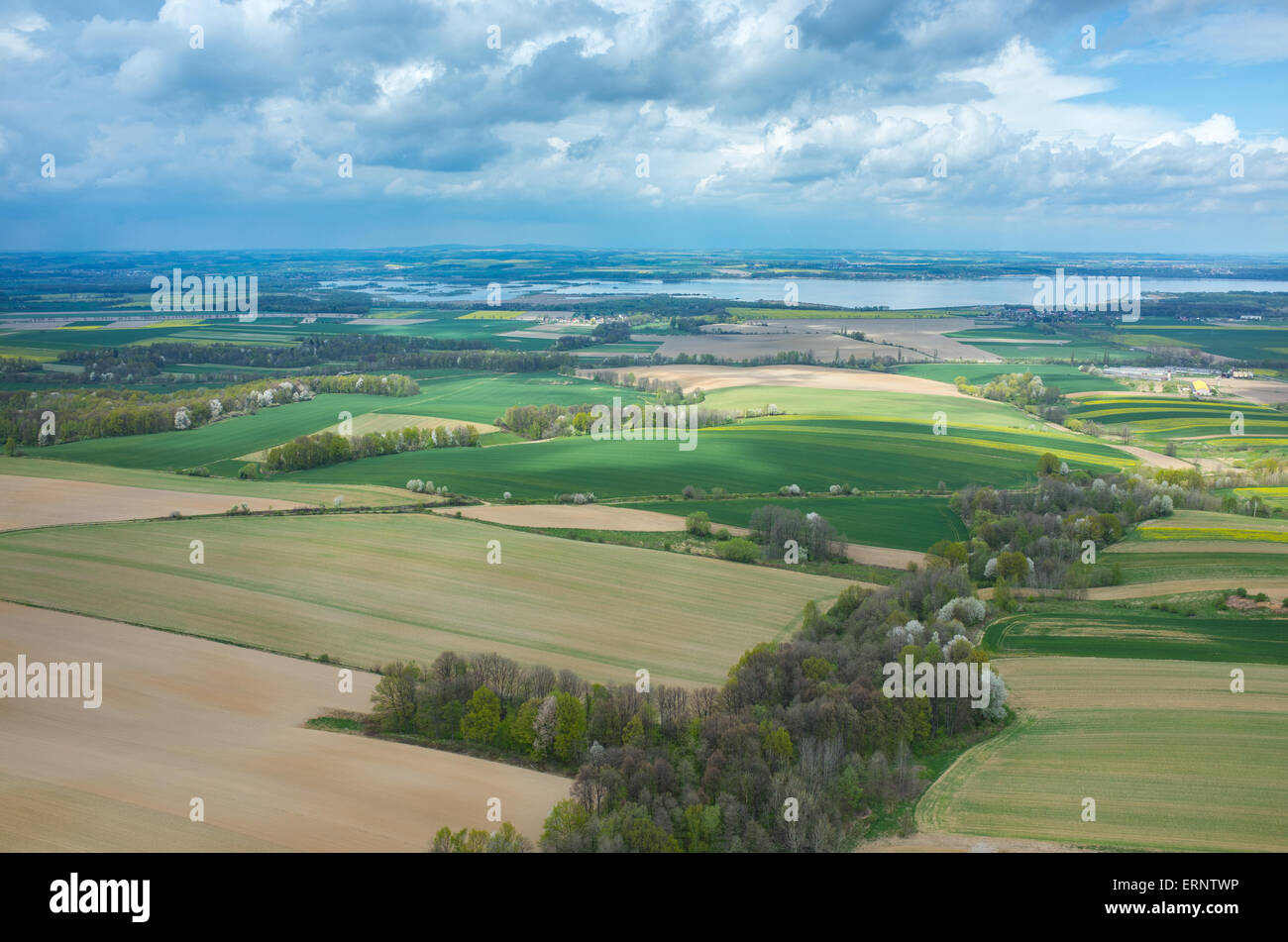 Aerial view on a small village surrounded by green fields Stock Photo ...
