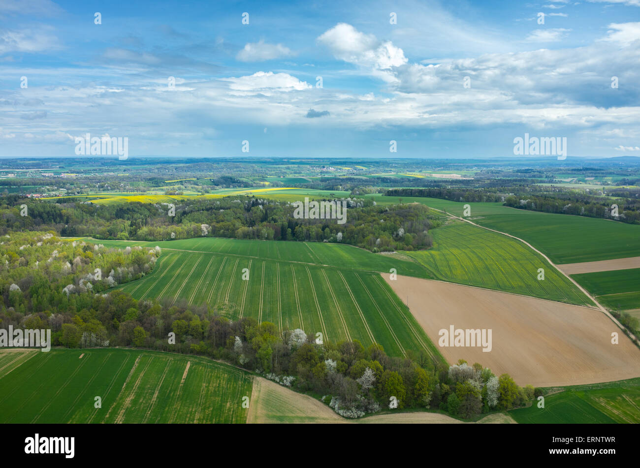 Aerial view on a small village surrounded by green fields Stock Photo ...