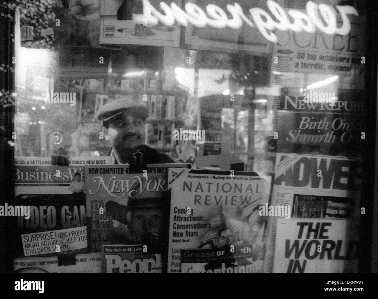 Chicago, IL, 14-Dec-1996: A newspaper man during late evening inside ...