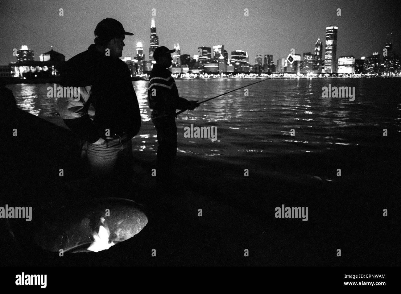 Chicago, IL, 21-Apr-1997: Two fishermen during night fishing at Navy ...