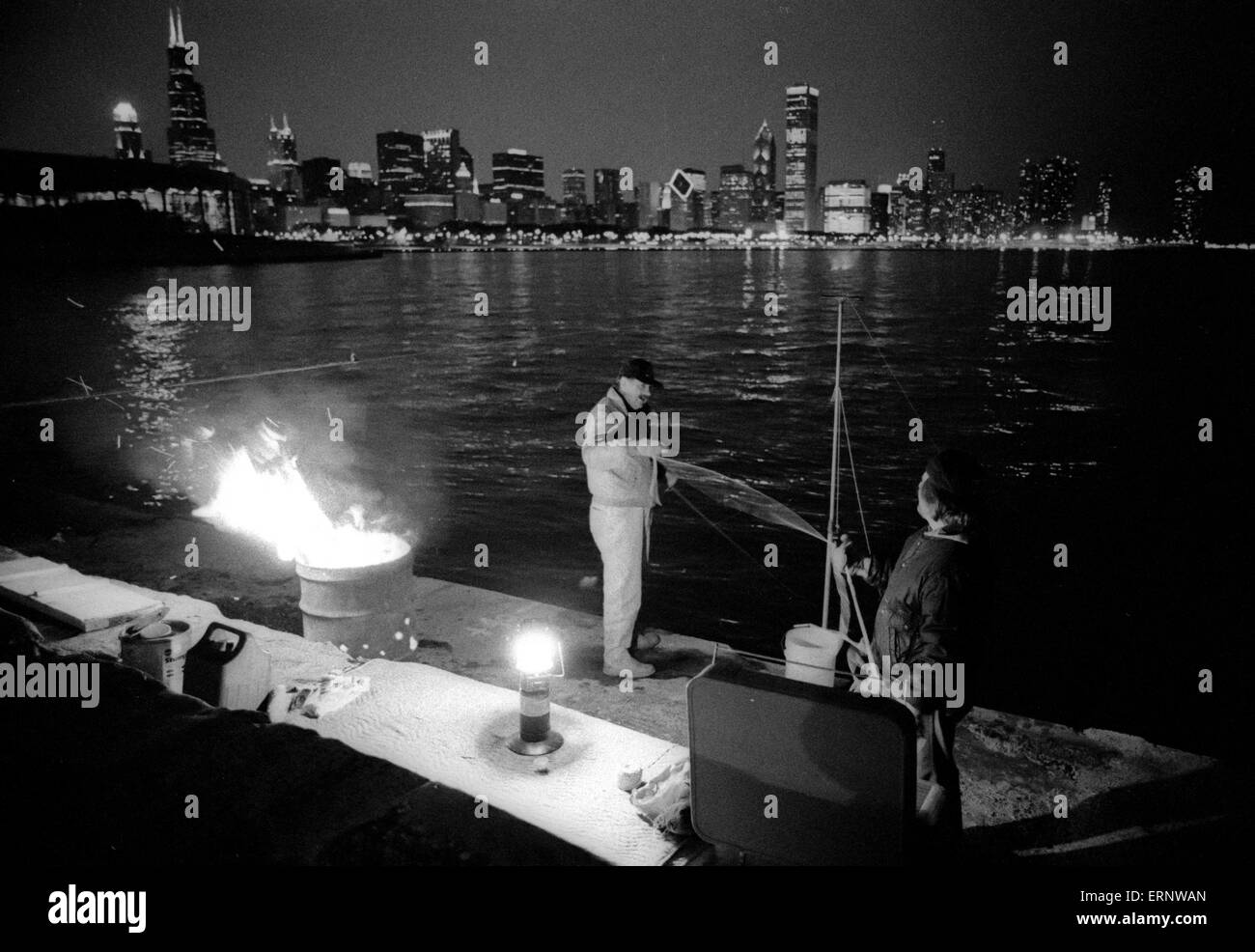 Chicago, IL, 21-Apr-1997: Two fishermen during night fishing at Navy ...