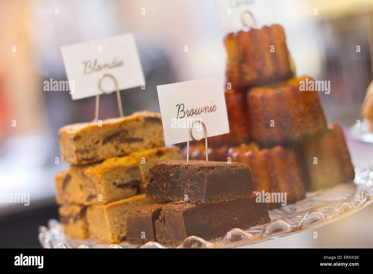 Display case of fresh brownies and blondies and dessert cakes Stock ...