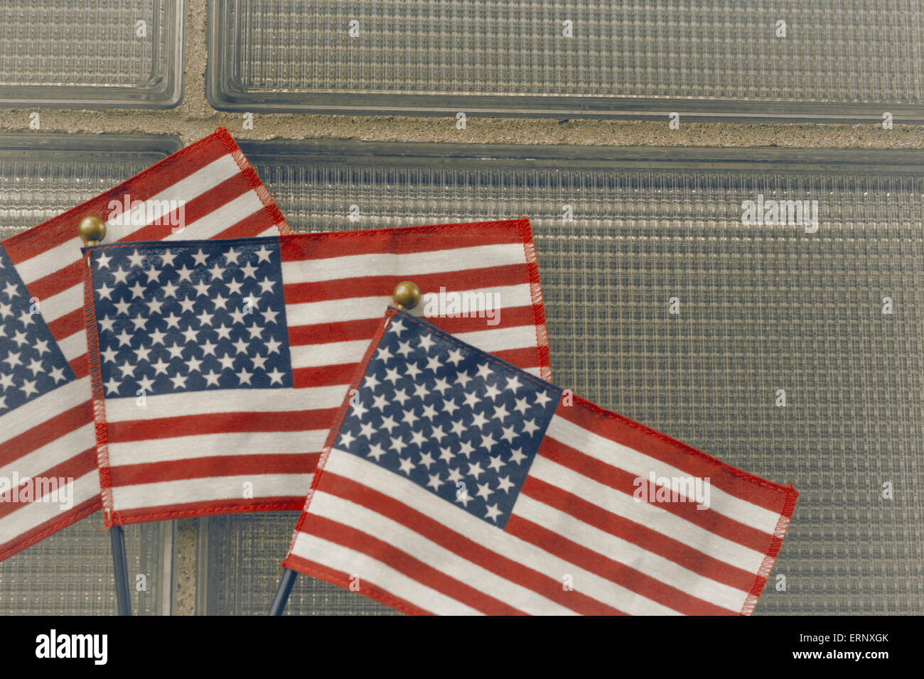 Waving three American flags in support the United States and freedom ...