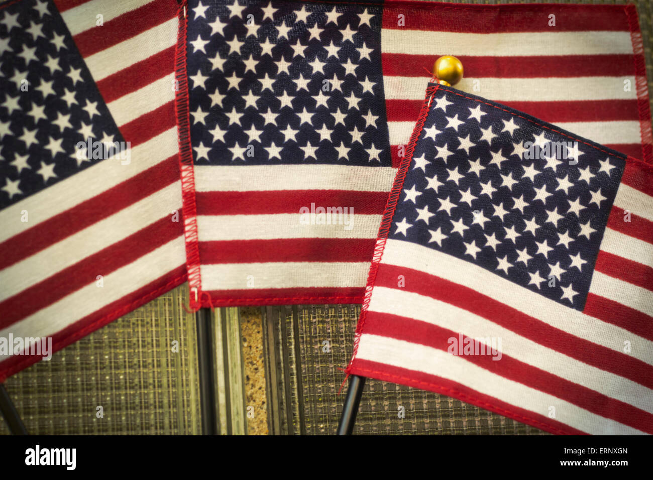 Waving three American flags in support the United States and freedom ...