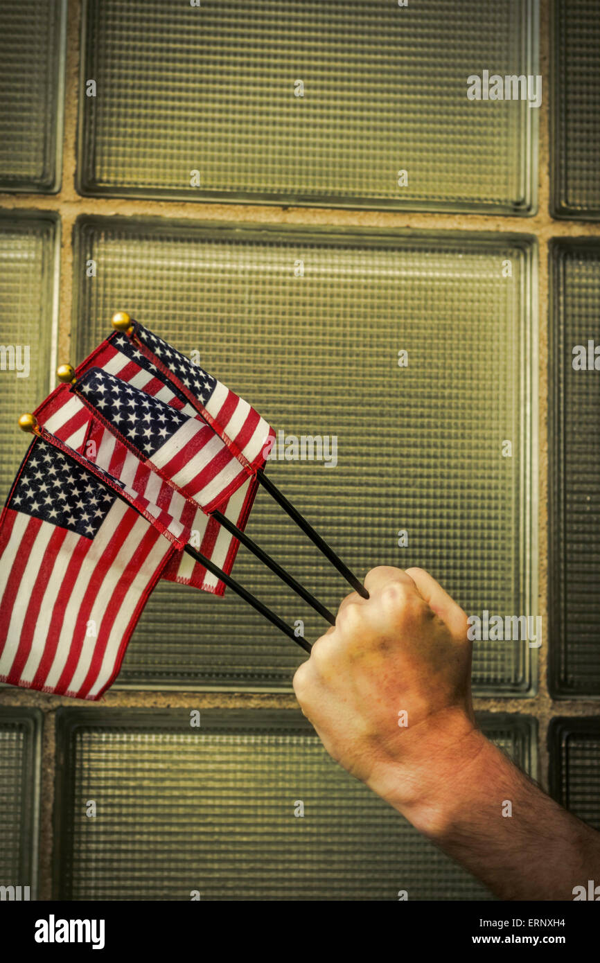 Waving three American flags in support the United States and freedom ...