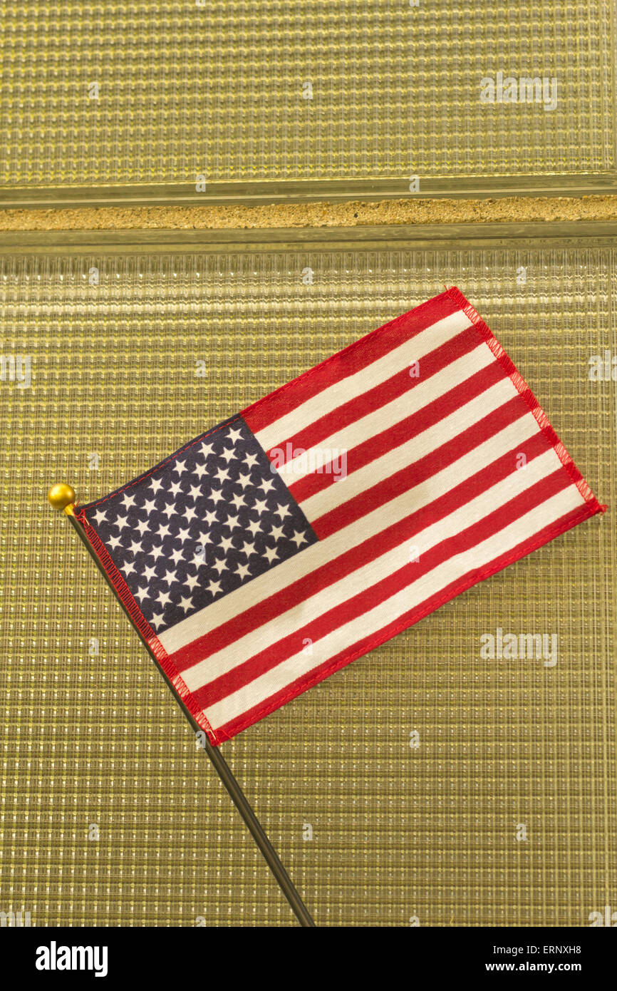 Waving three American flags in support the United States and freedom ...