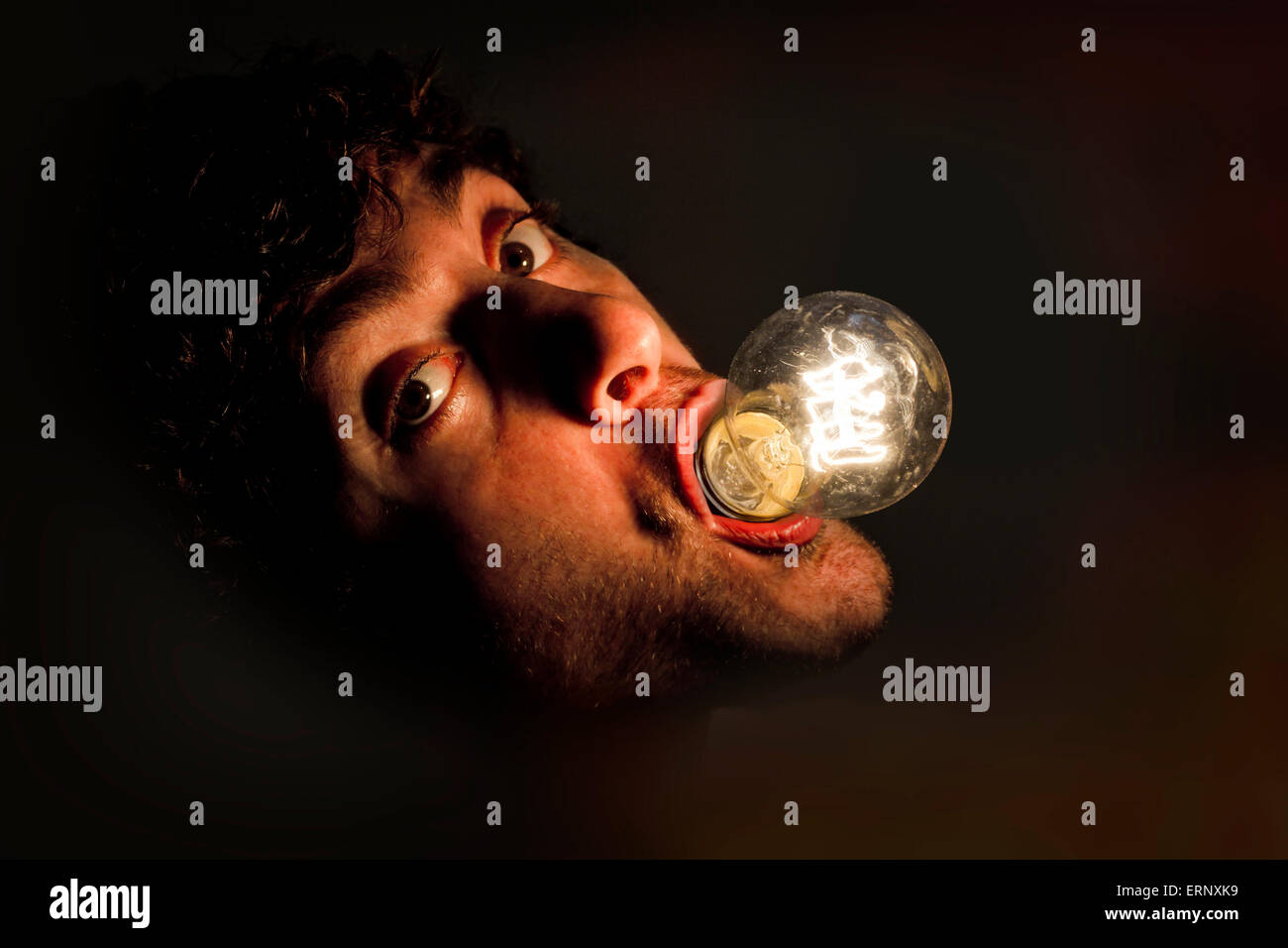 Mouth eating light bulb hi-res stock photography and images - Alamy