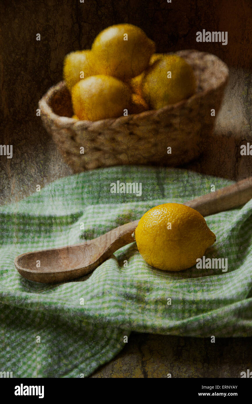 A spoon and lemon sit on a kitchen towel getting ready to create some ...