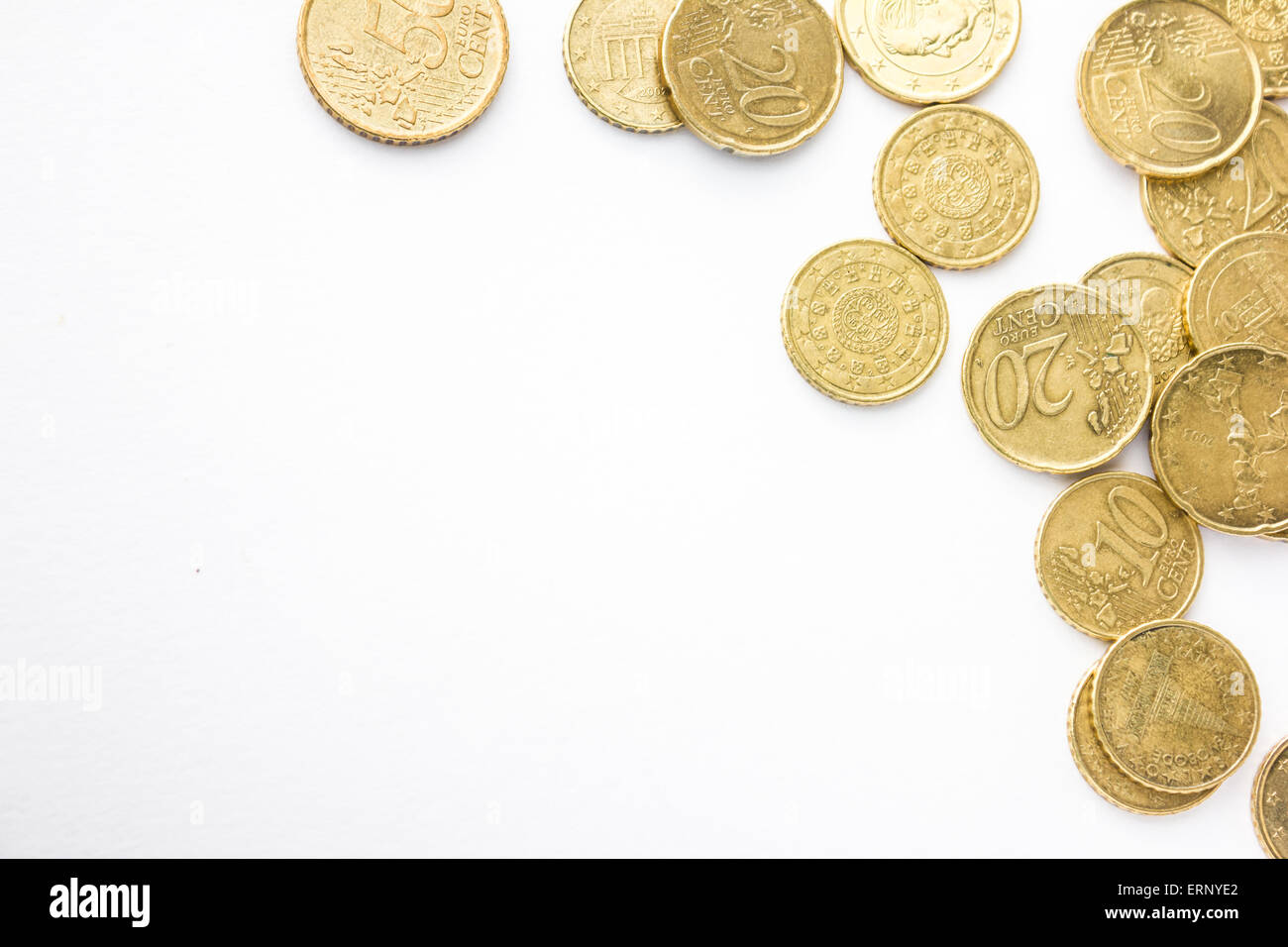 Golden European coins in white background Stock Photo - Alamy
