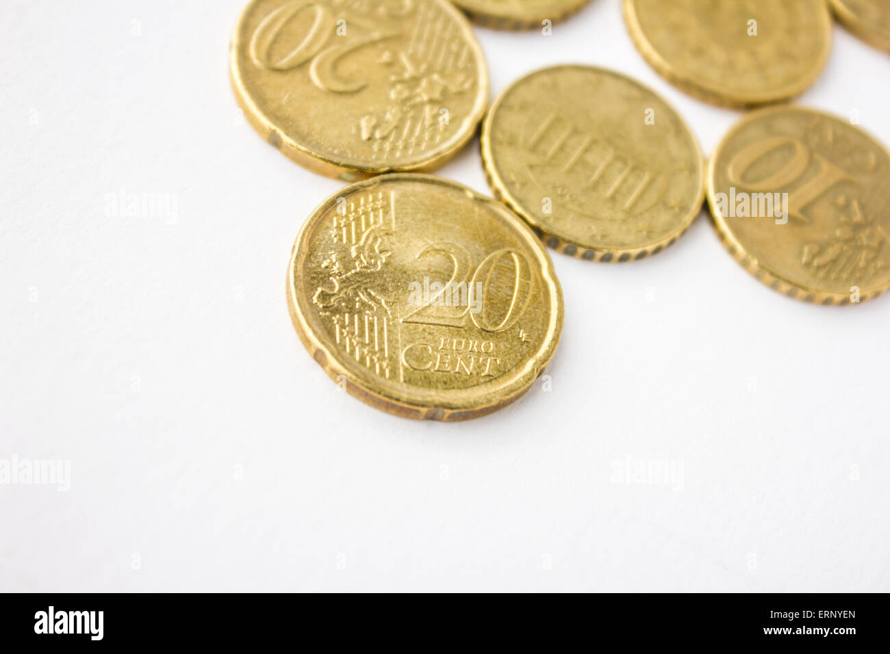 Golden European coins in white background Stock Photo - Alamy