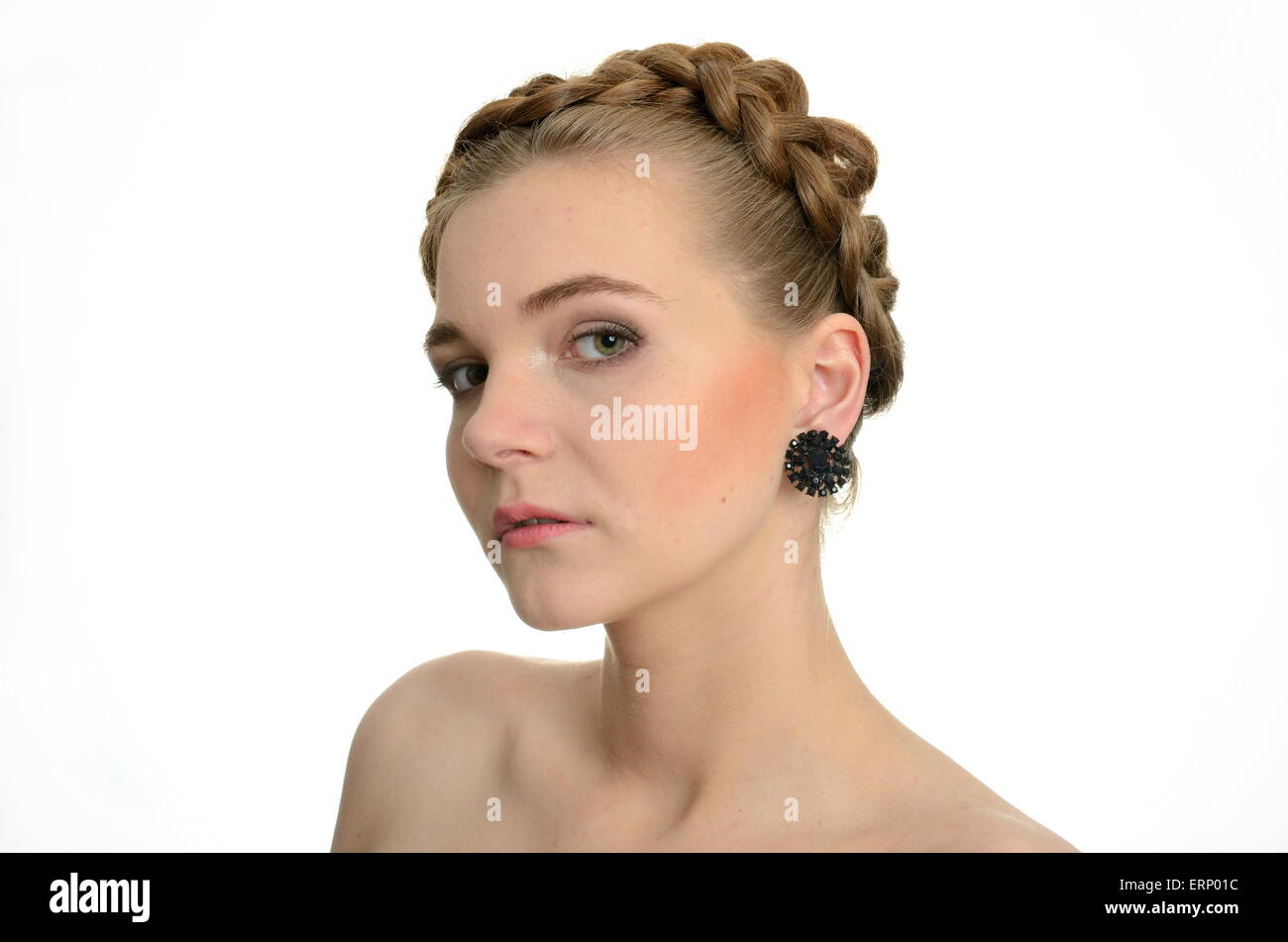 Young female model wearing black earrings. Gentle face expression Stock ...