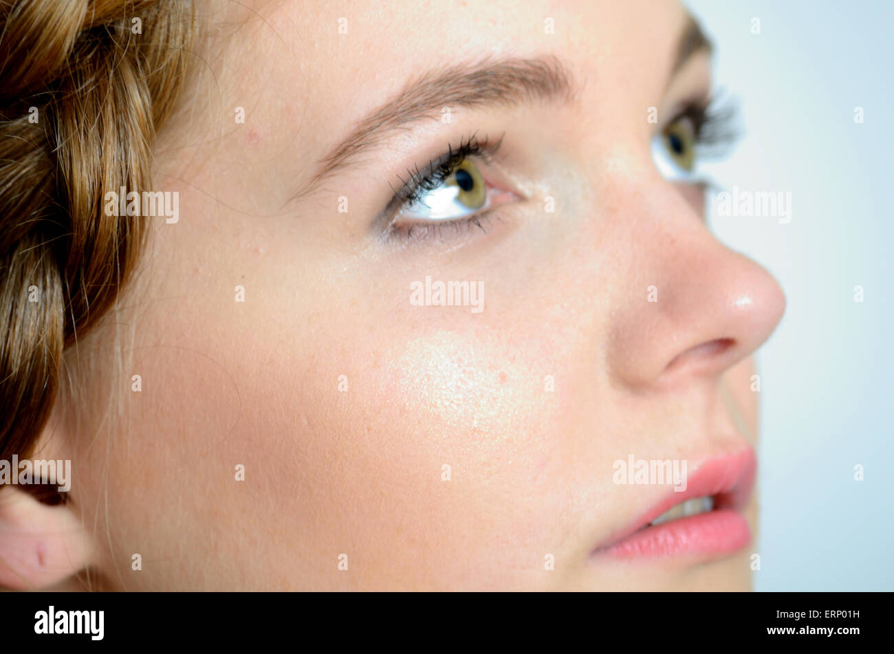 Closeup photo of face. Young female model with gentle face expression ...