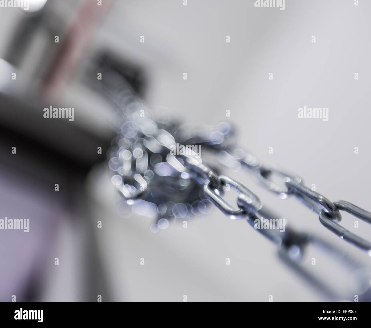 hanging metal chain closeup, tied in a knot Stock Photo - Alamy