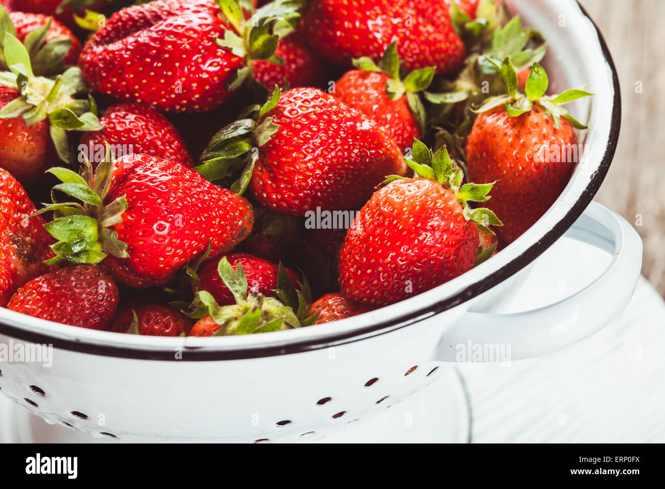 Strawberries in colander Stock Photo - Alamy