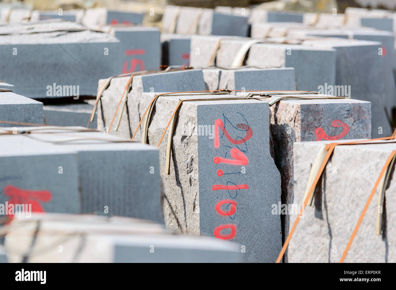 Large slabs of granite secured by belts on pallets. Every stone is ...