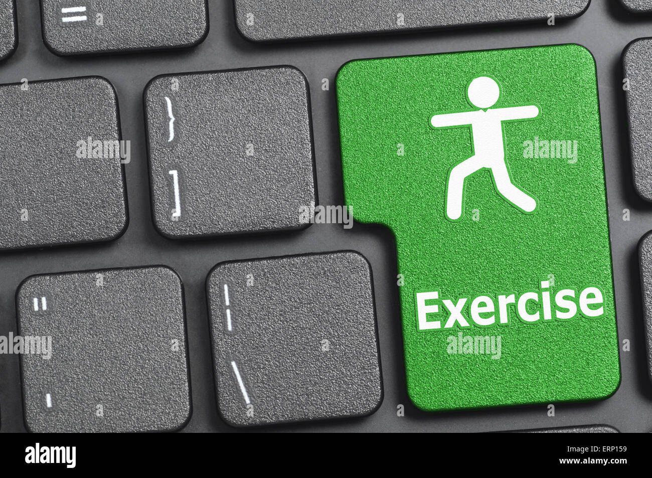 Green exercise key on keyboard Stock Photo - Alamy