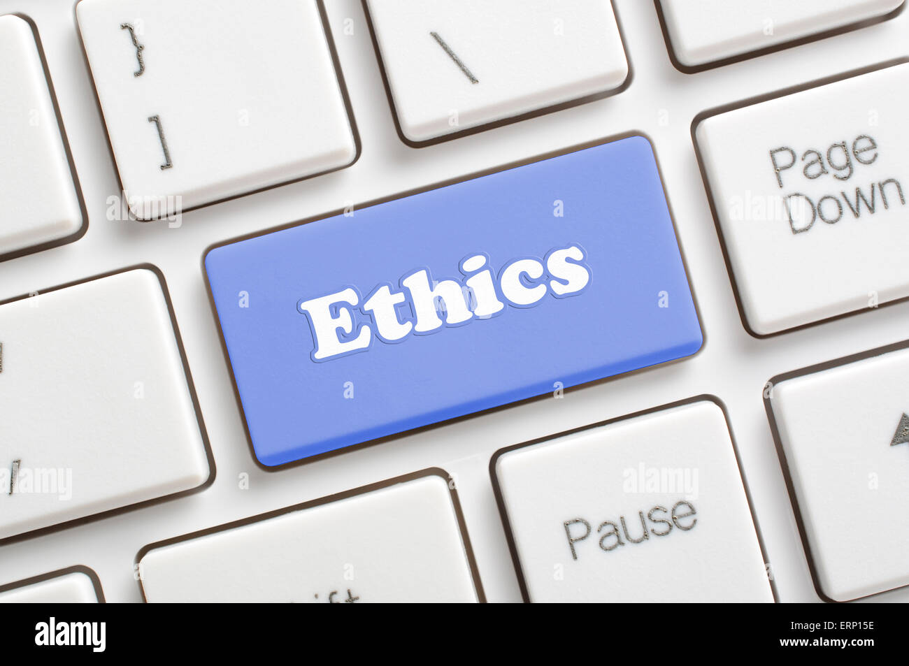 Blue ethics key on keyboard Stock Photo - Alamy