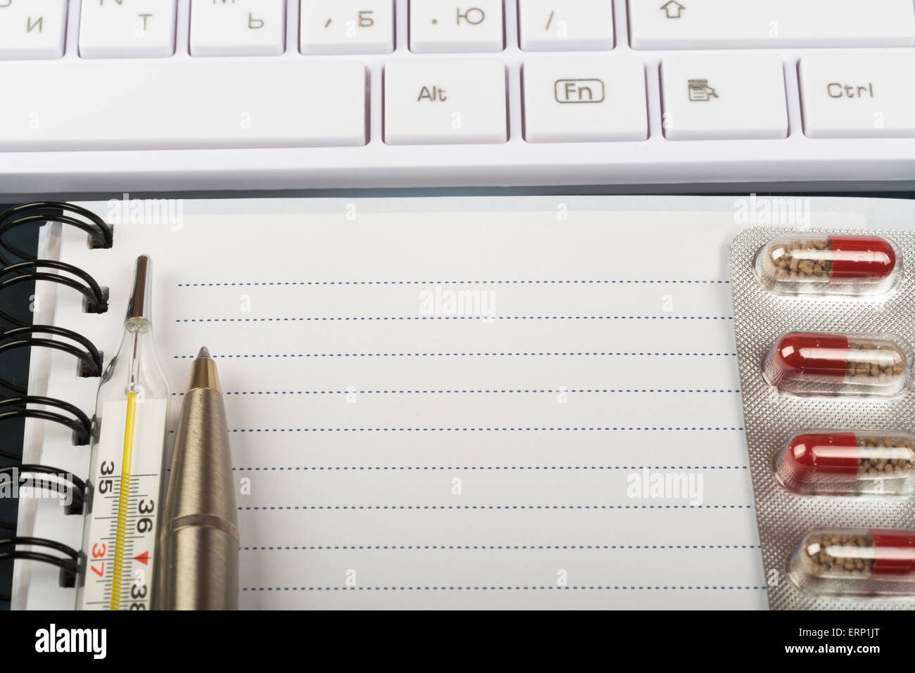 Keyboard and notebook Stock Photo - Alamy