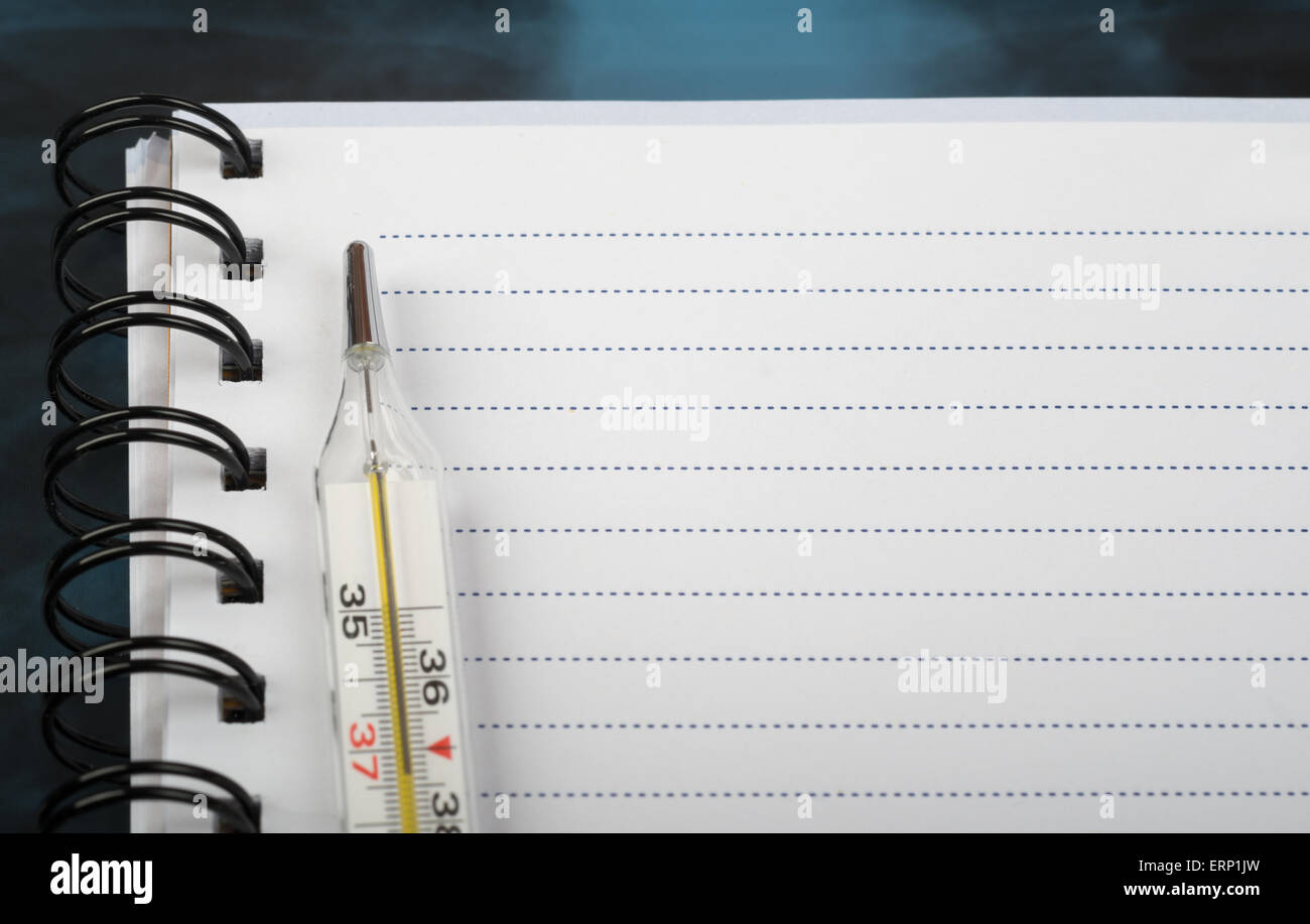 X-ray examination and copy book with thermometer Stock Photo - Alamy