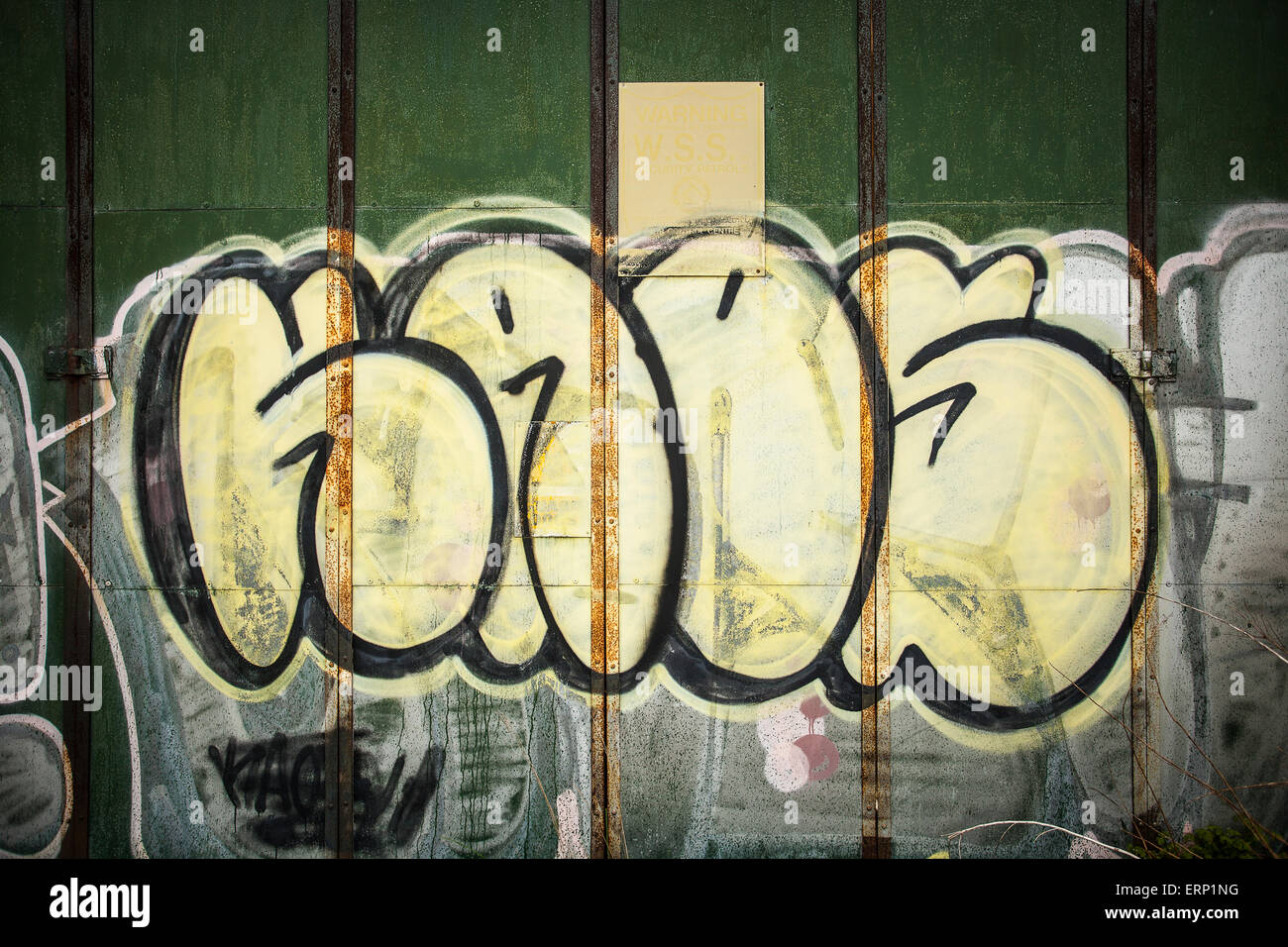Graffiti on a green wall Stock Photo - Alamy