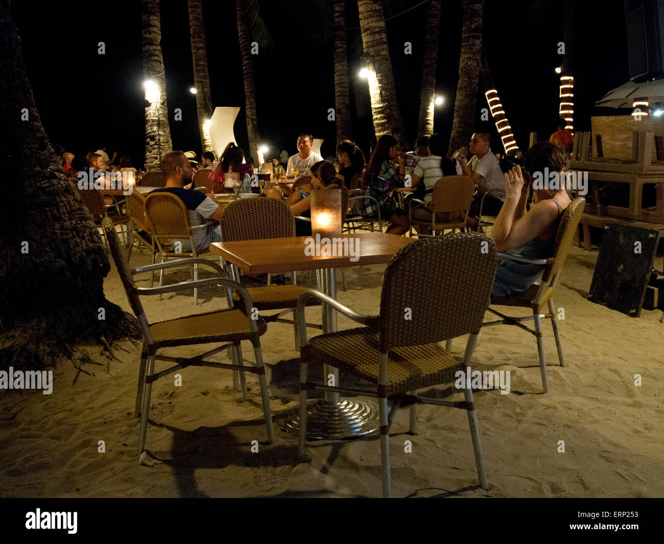 Tourists at a restaurant and bar at night in Boracay, Philippines Stock ...