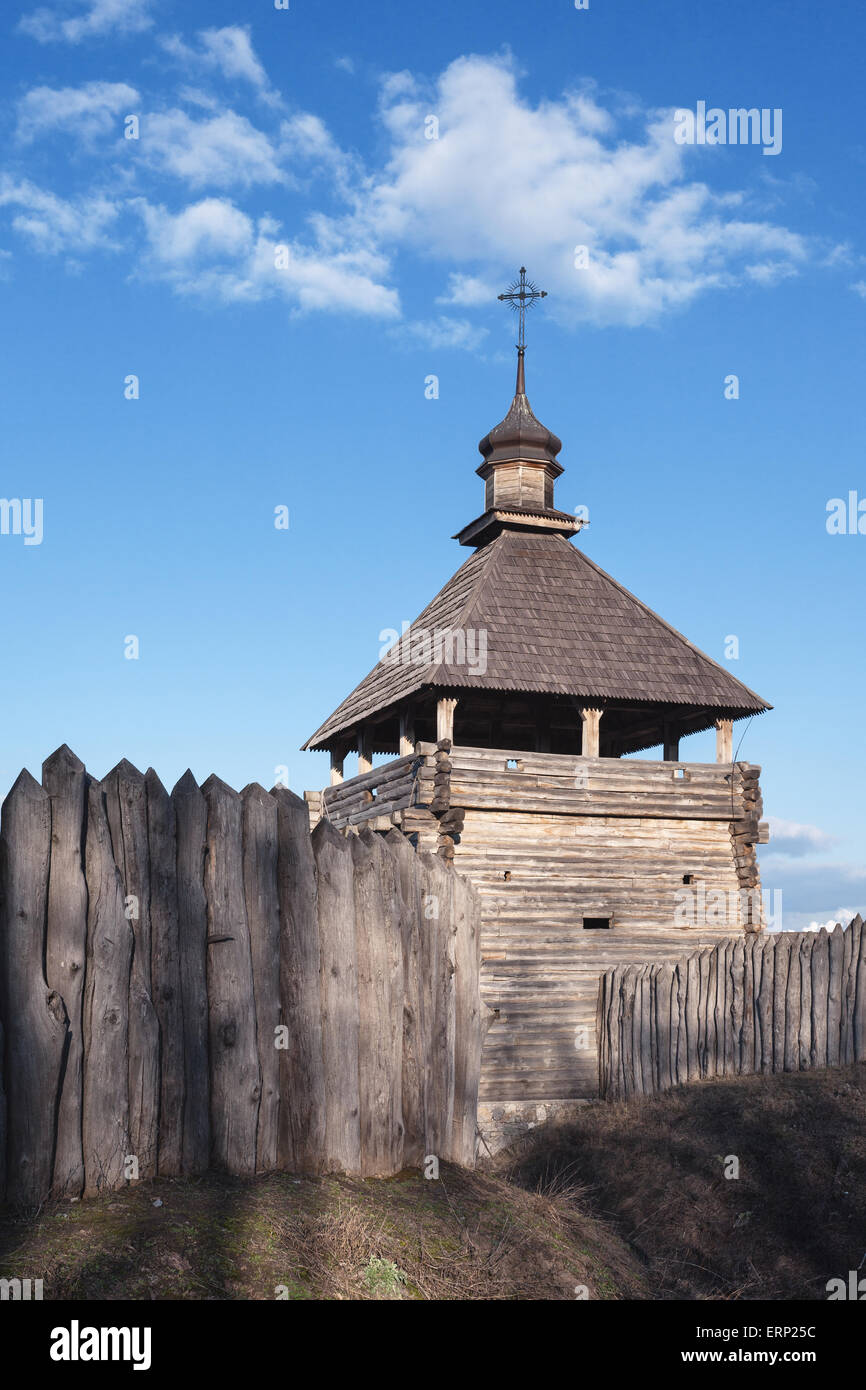 Old wood rustic church building and wooden fence against blue sky at ...