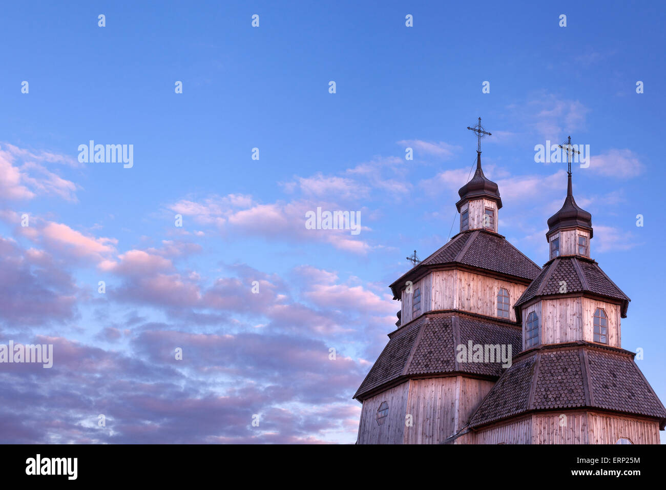 Old wood rustic church building and wooden fence against blue sky at ...
