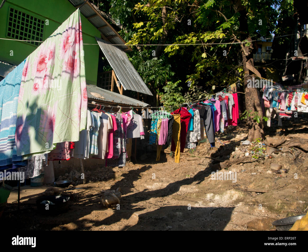 Laundry drying in the sun in a slum in Ilo Ilo, Philippines Stock Photo ...