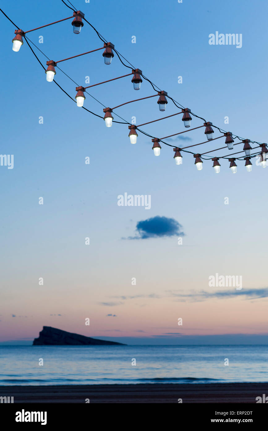 row of light bulbs on the beach at sunset Stock Photo - Alamy