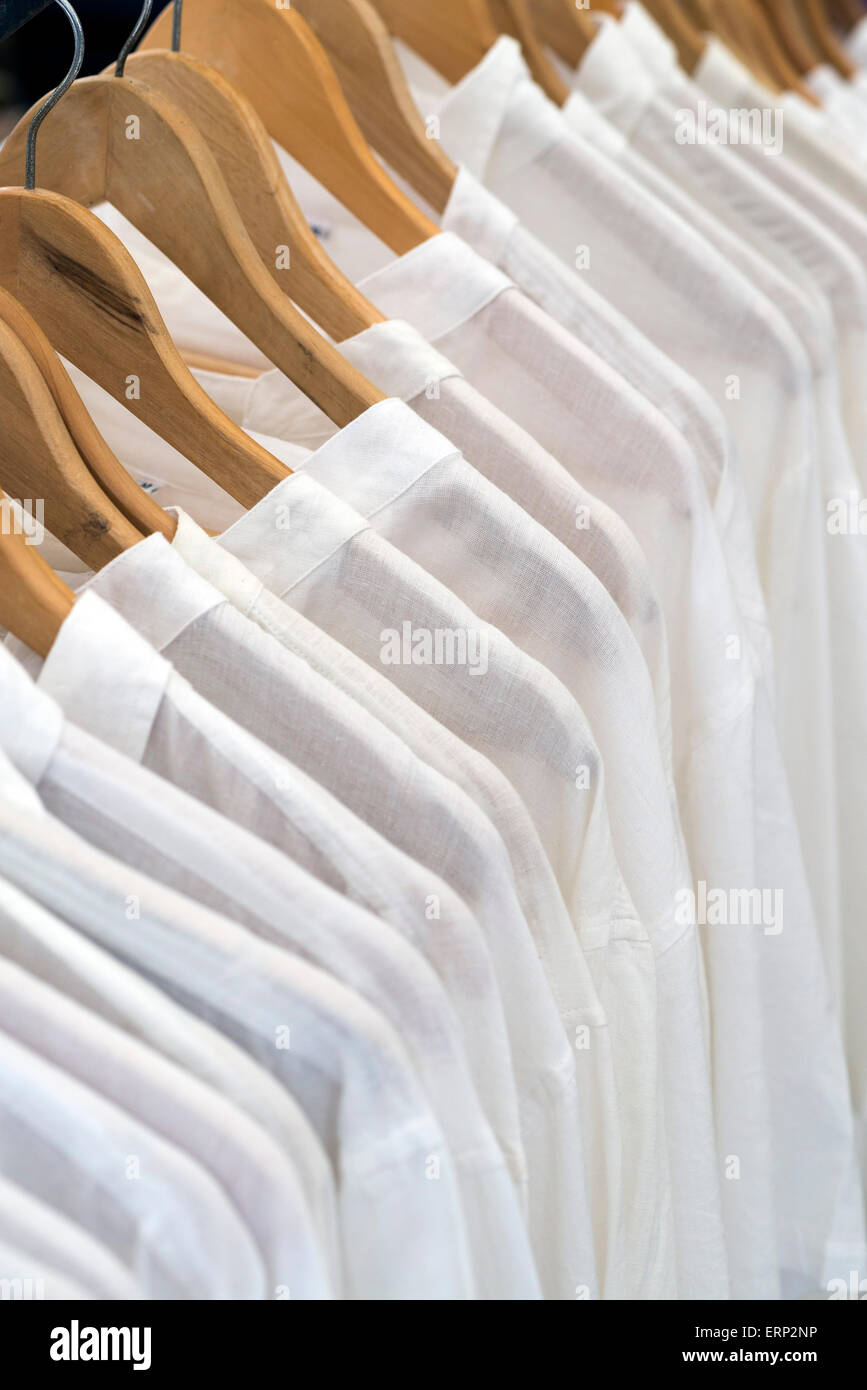 Shirts hanging stack, close up Stock Photo - Alamy