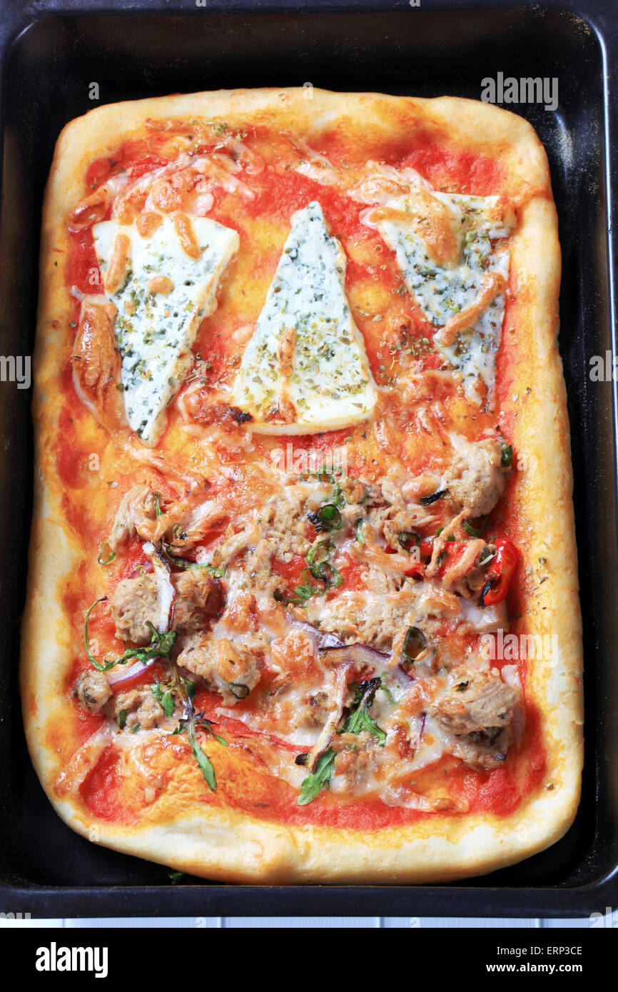 Rectangular pizza topped with blue cheese and tuna Stock Photo - Alamy