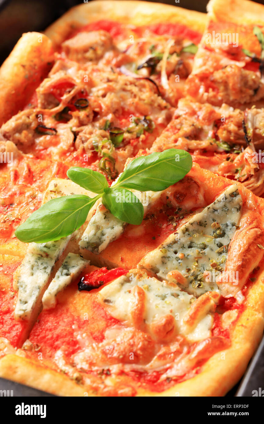 Rectangular pizza topped with blue cheese and tuna Stock Photo - Alamy