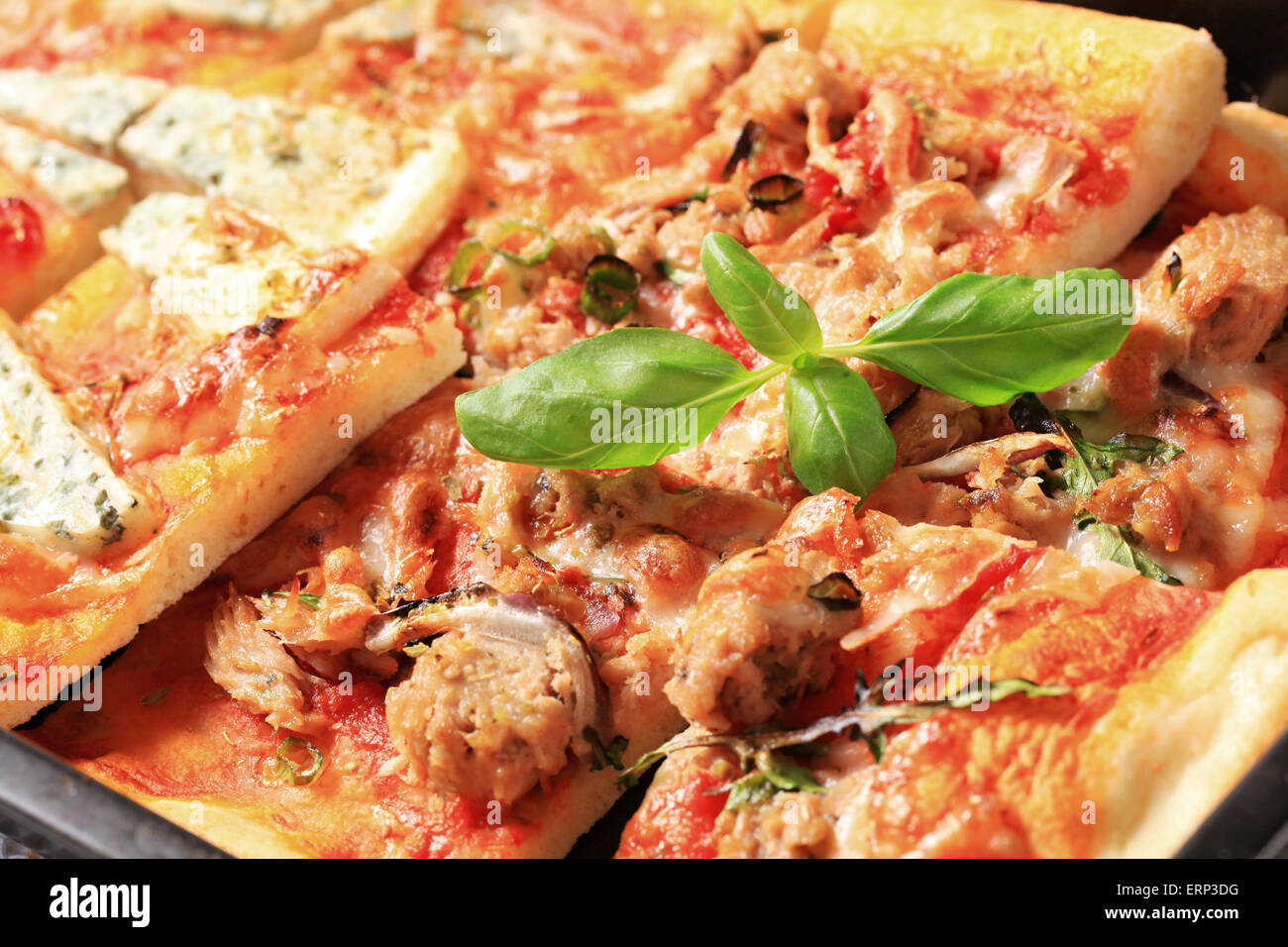 Rectangular pizza topped with blue cheese and tuna Stock Photo - Alamy