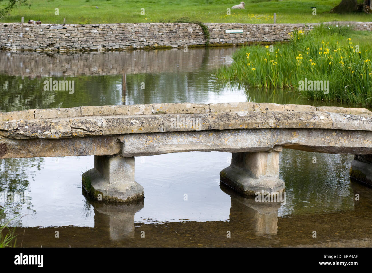 Stone Bridge across river in Lower Slaughter The Cotswolds England ...