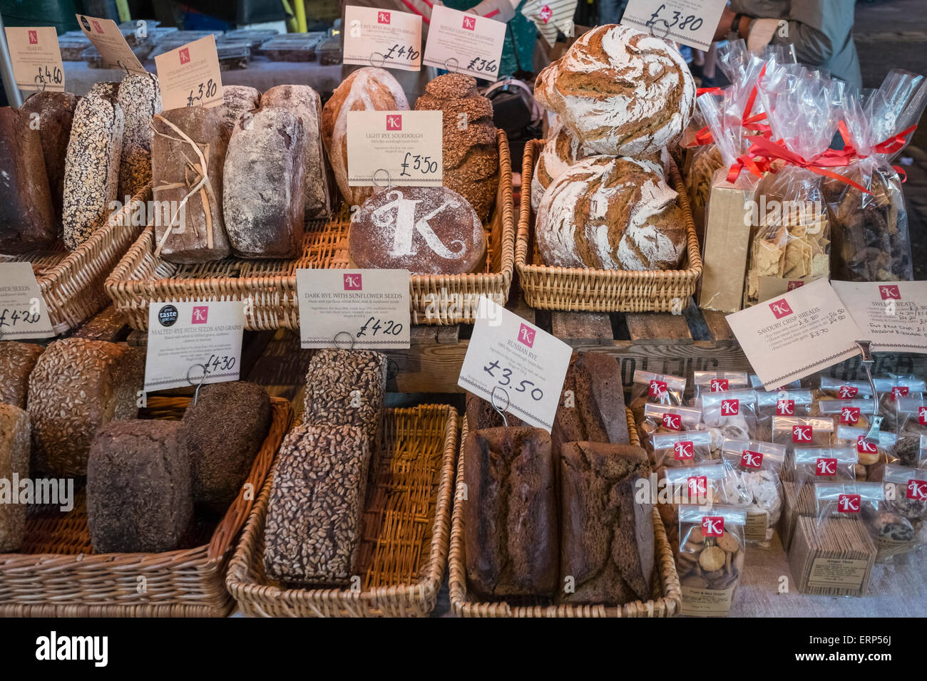 Attractive artisan hand made bread for sale at market stall, London UK ...