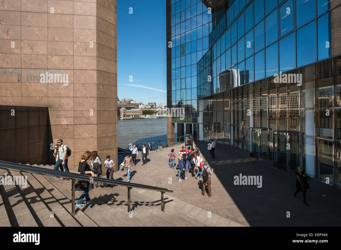 People walking along River Thames Path at 1 London Bridge building ...