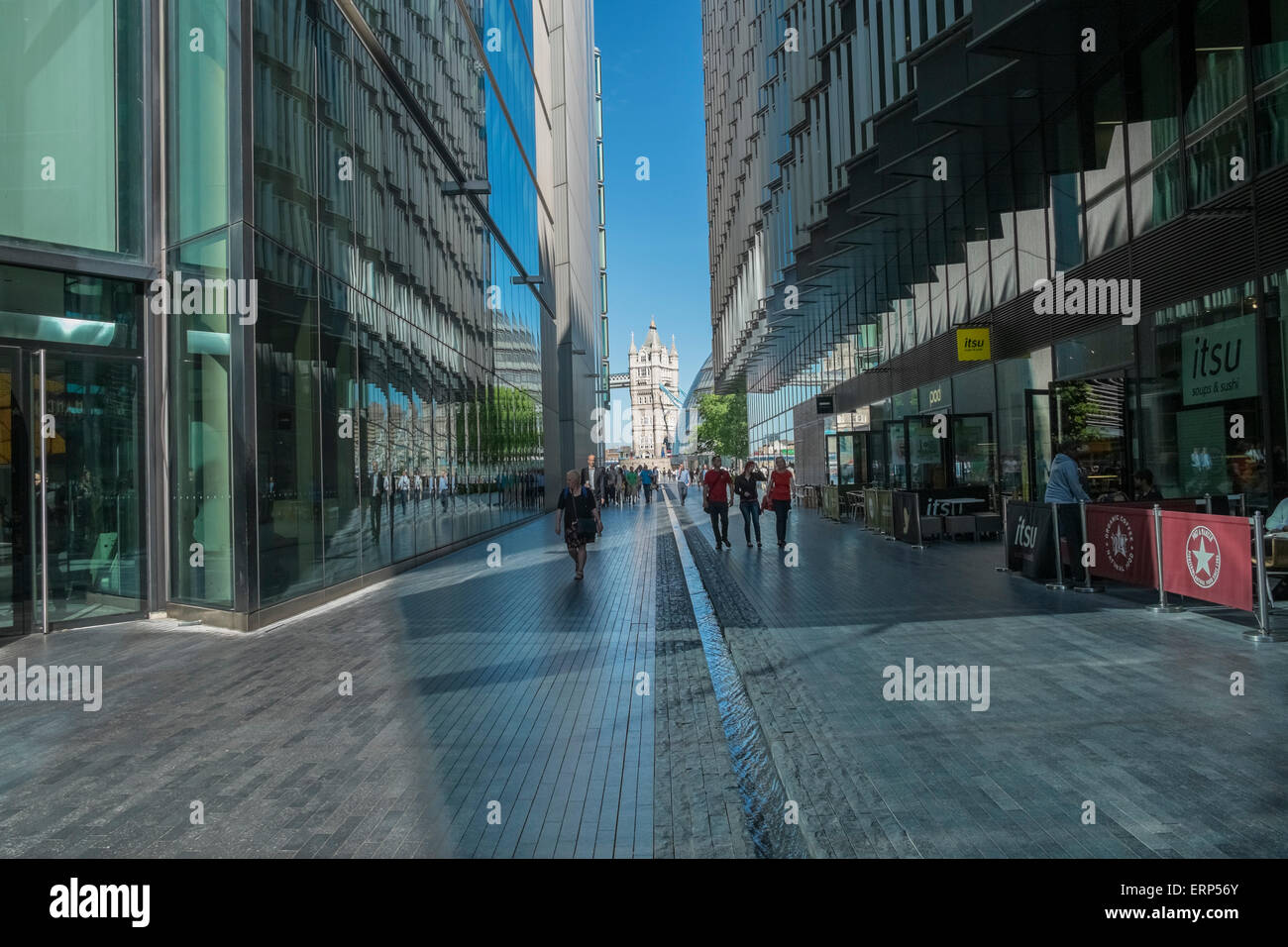 Tower Bridge viewed through modern architecture of More London Stock ...